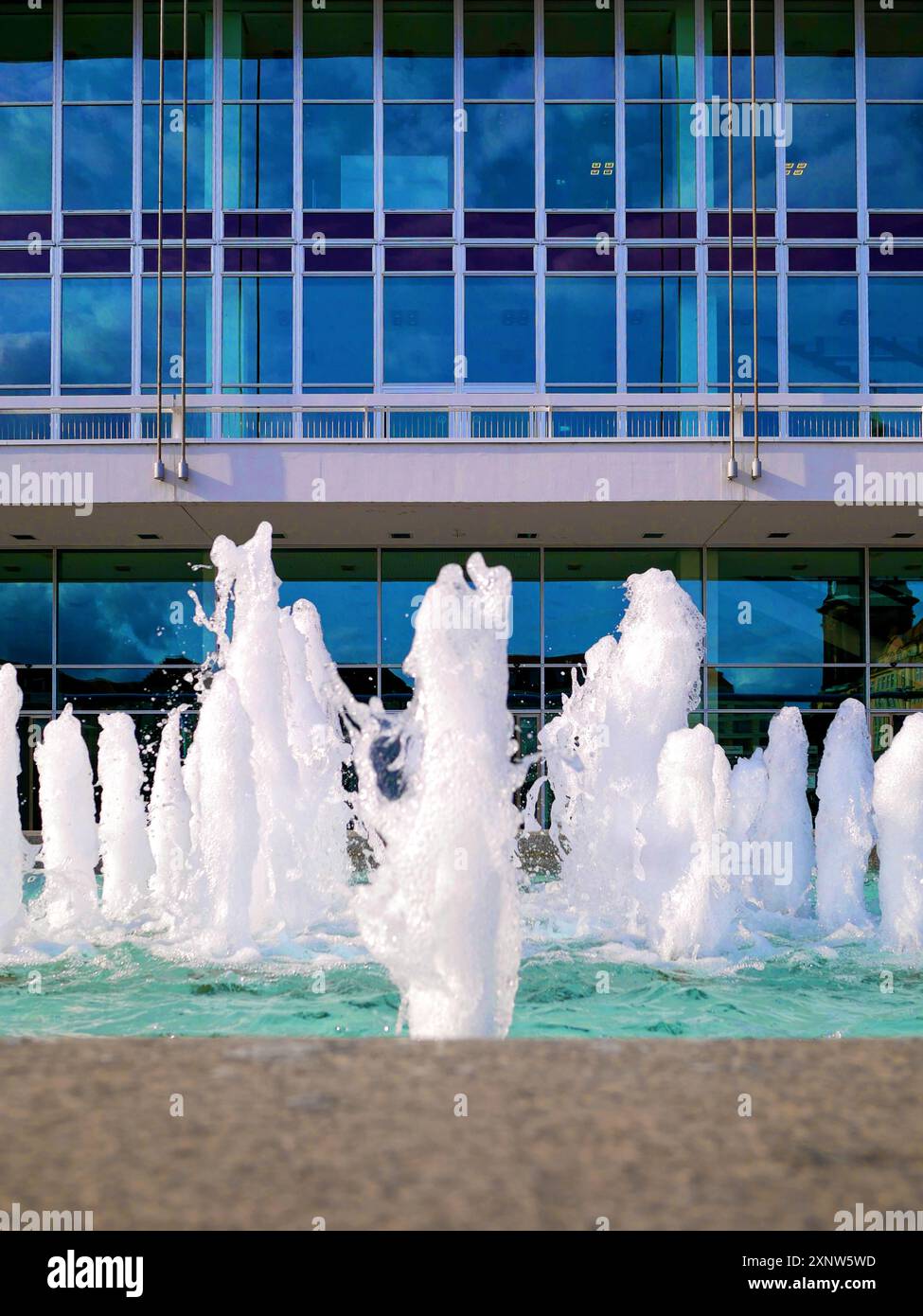 The fountain in front of the Cultural Palace Dresden bubbles lively and ...