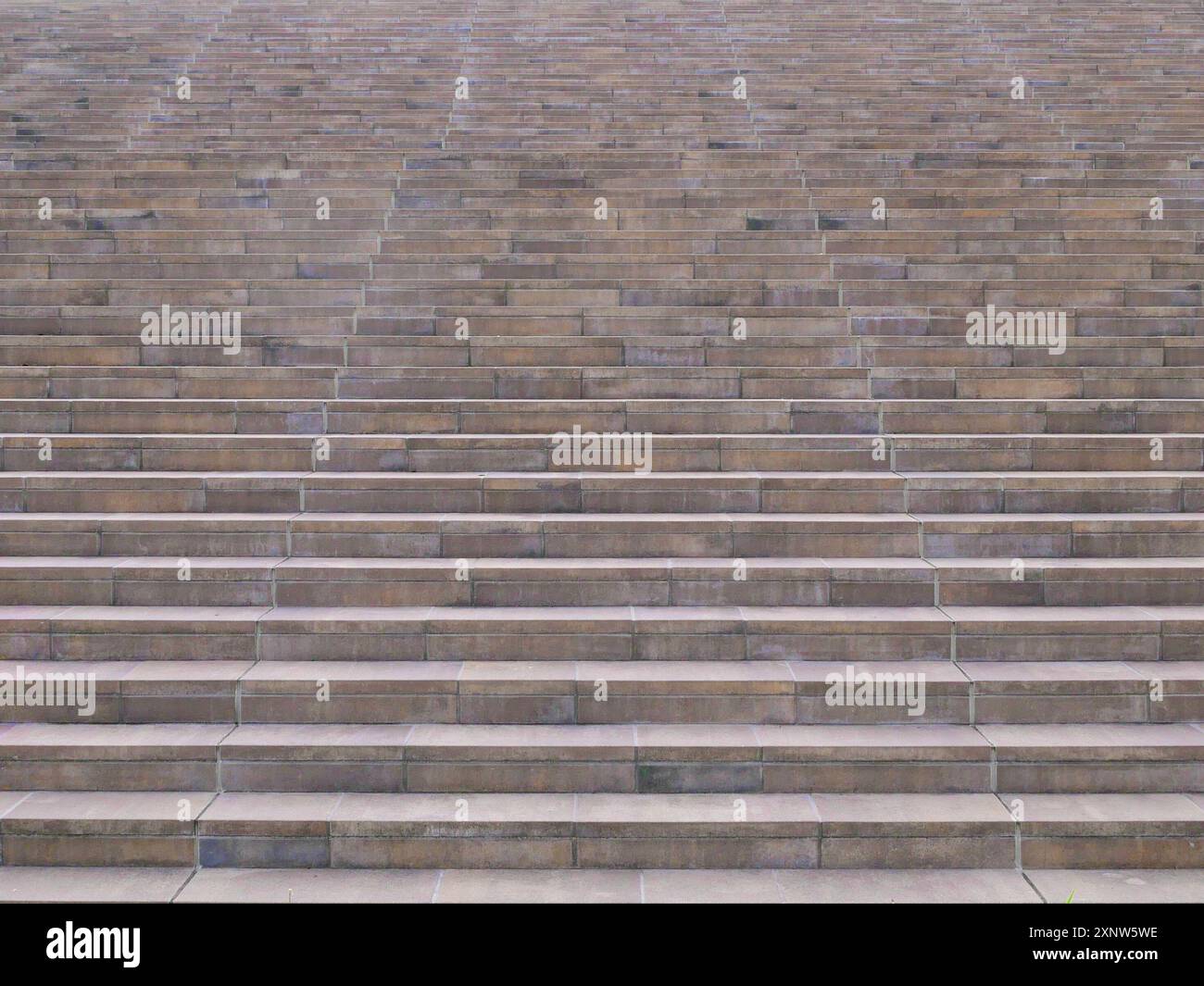 A wide granite staircase leads up to the convention center, symbolizing ...