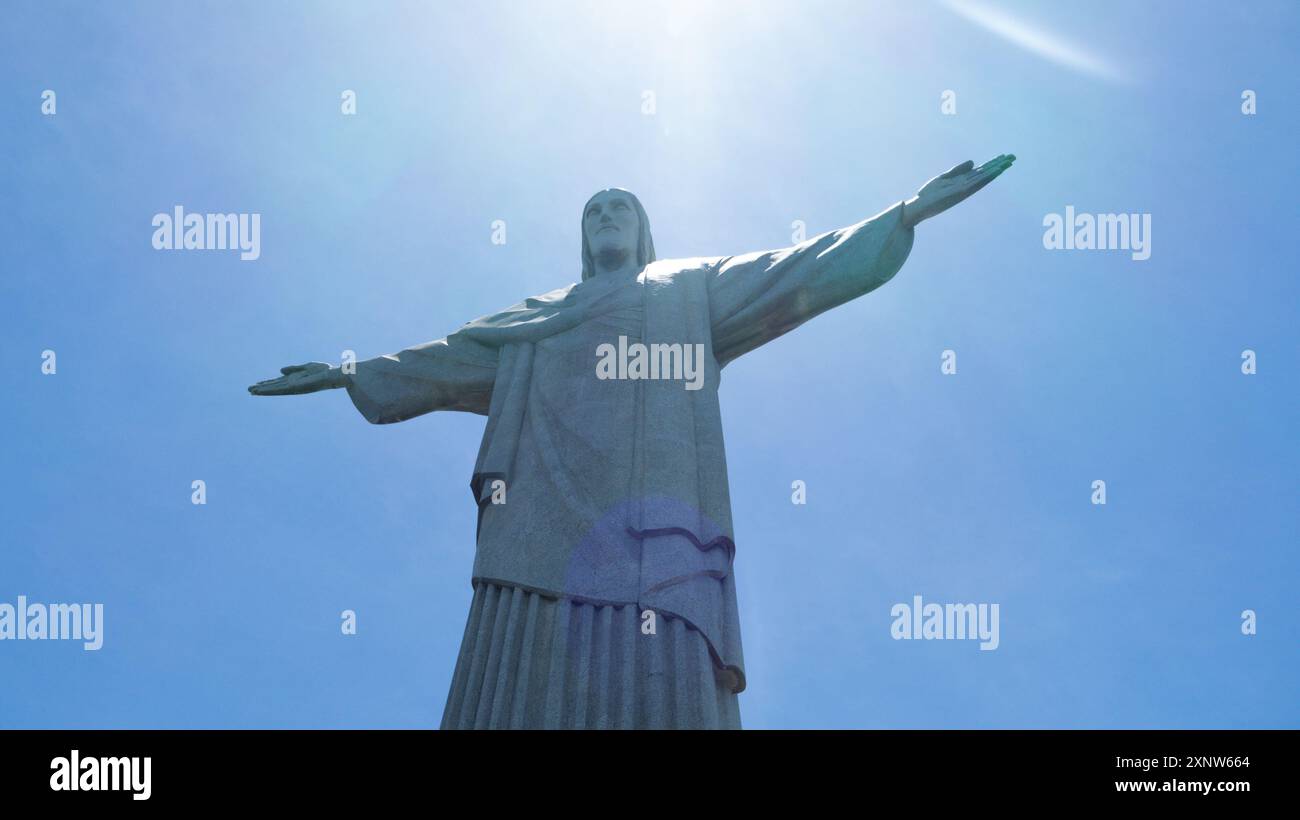 Famous Christ the Redeemer statue under the sunny blue sky at Rio de ...