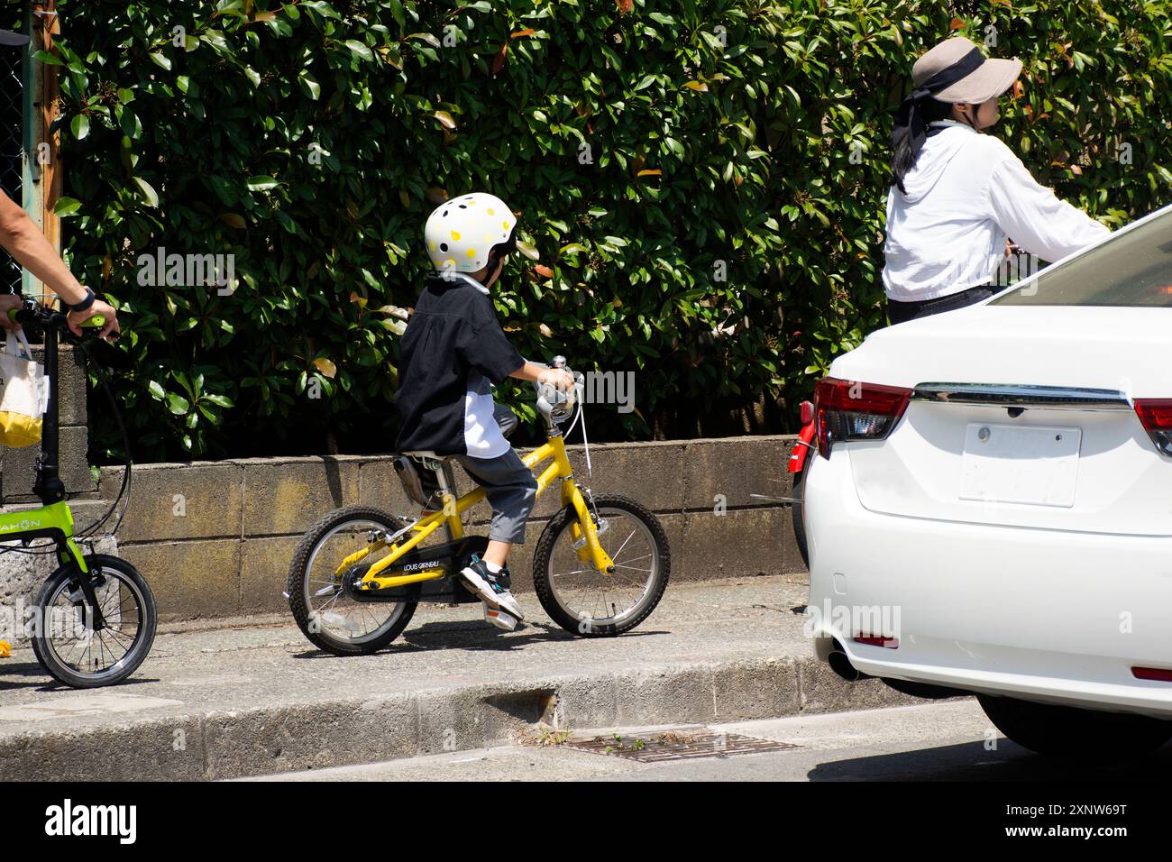 Japanese family father mother and son ride bicycle and biking on ...