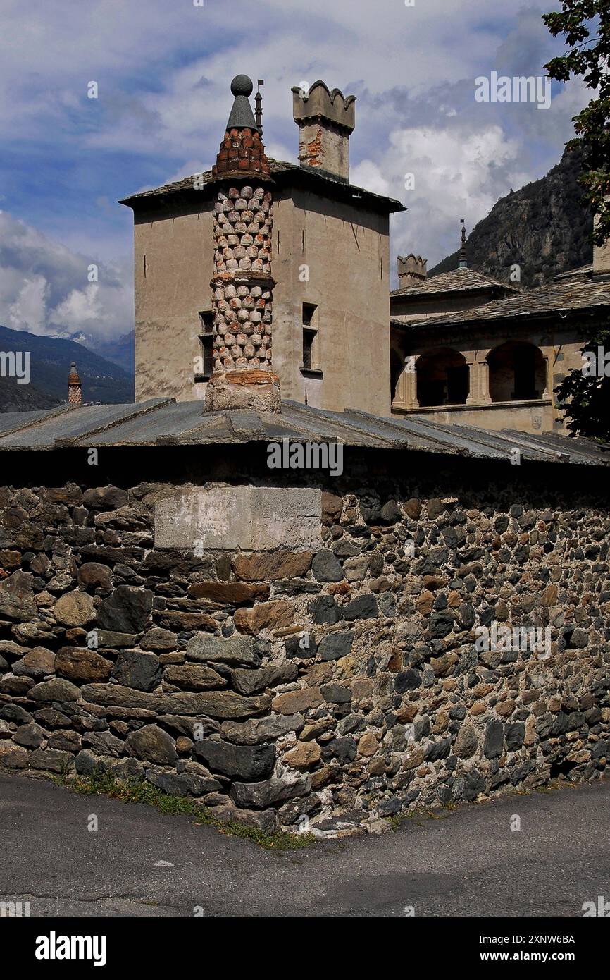 Distinctive brick finial at corner of stone wall surrounding the ...