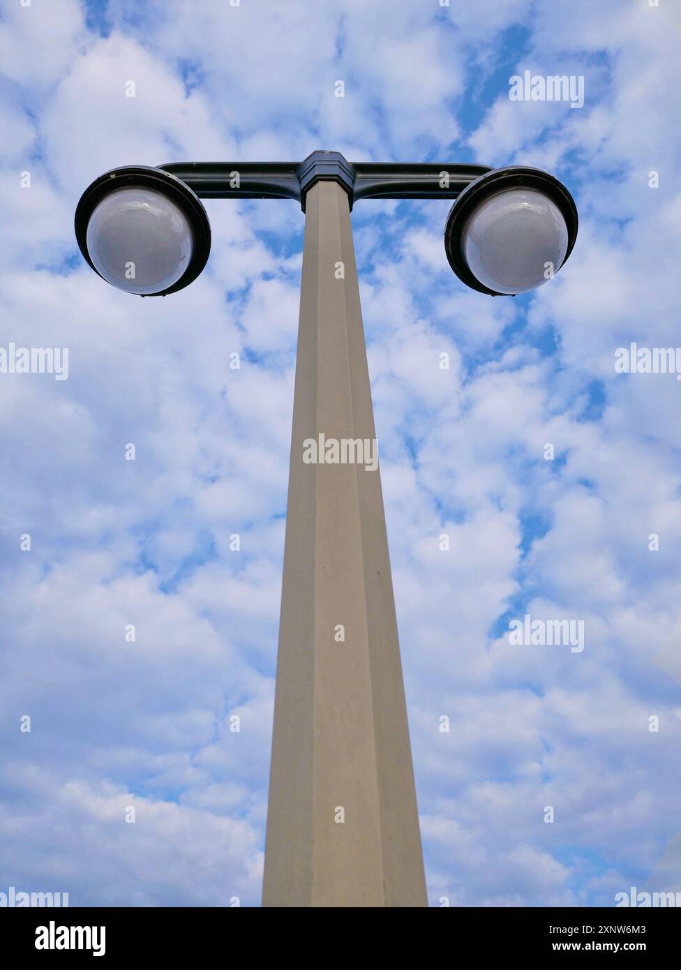 A two-flame street lamp with insect-friendly glass domes, photographed ...