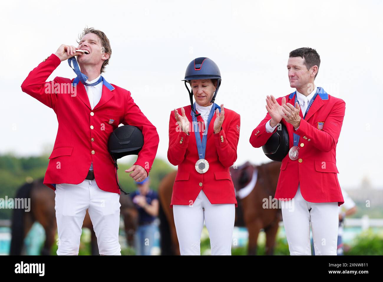 USA's' Karl Cook, McLain Ward and Laura Kraut celebrate with their ...