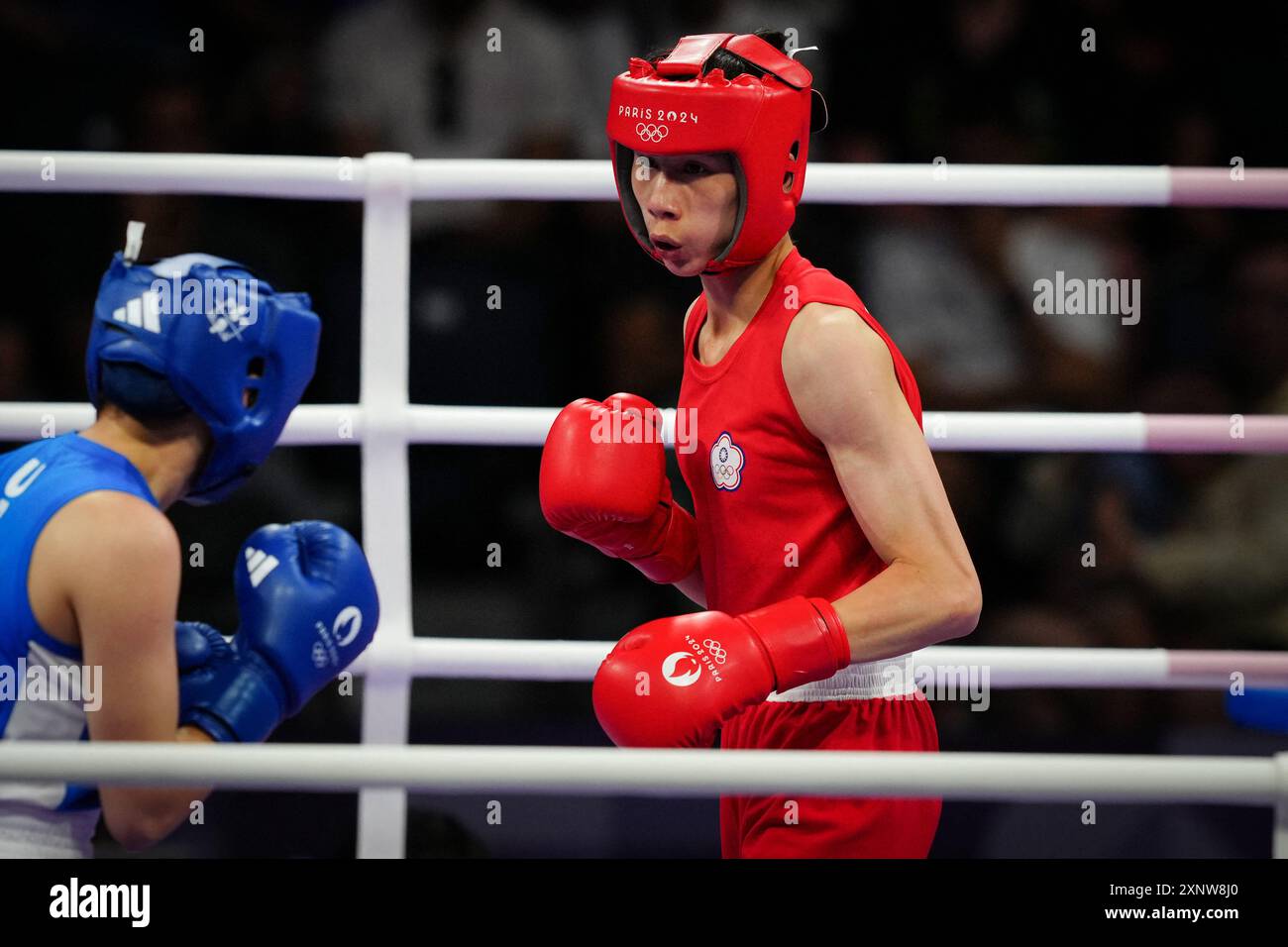 Chinese Taipei's controversial boxer Lin Yu-ting ( in red ) won her ...