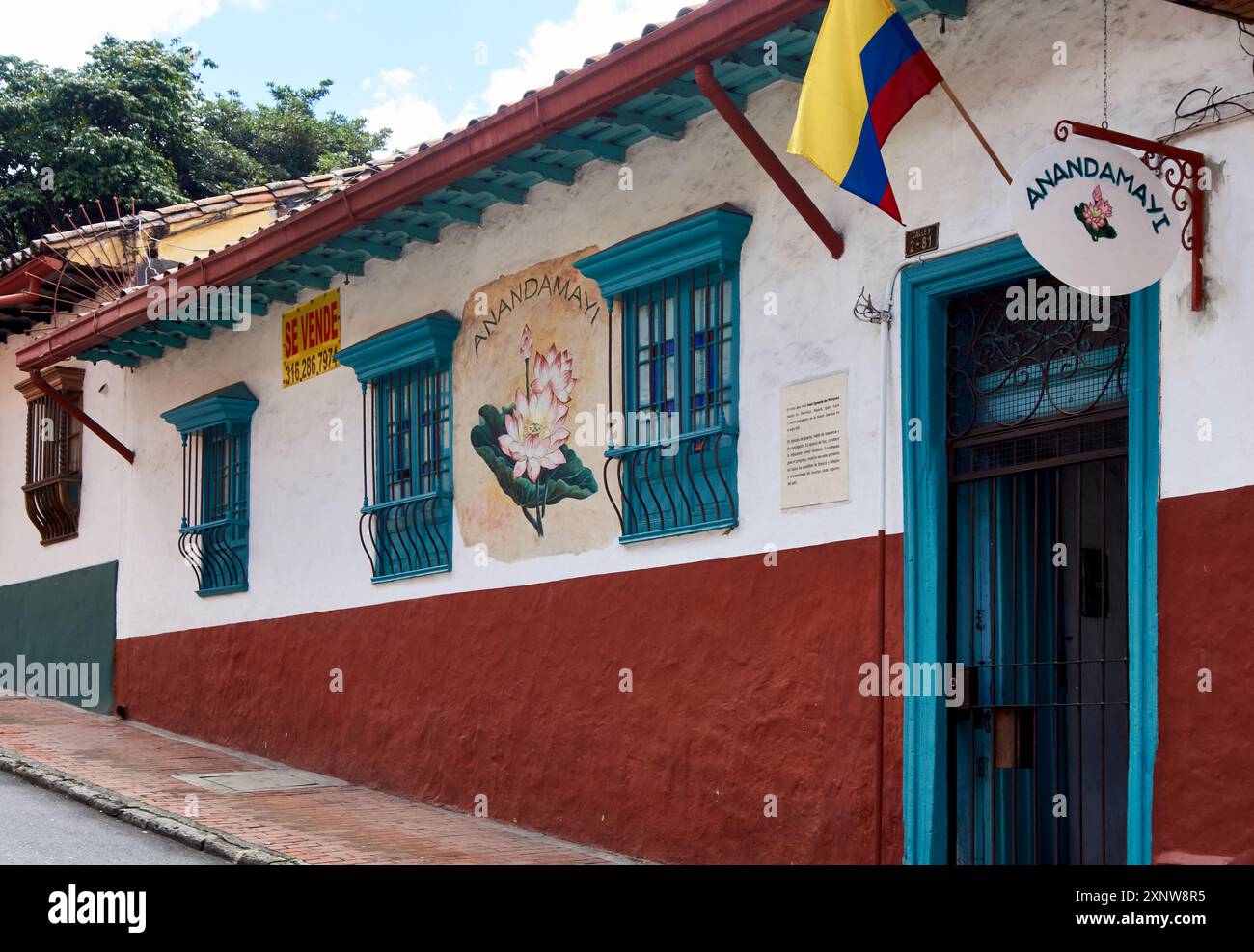 Vibrant street scene featuring a colorful building with the Colombian ...