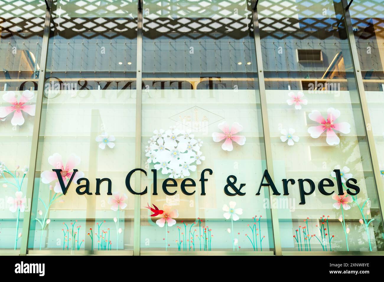 Van Cleef and Arpels cherry blossom logo and brand name above the ...