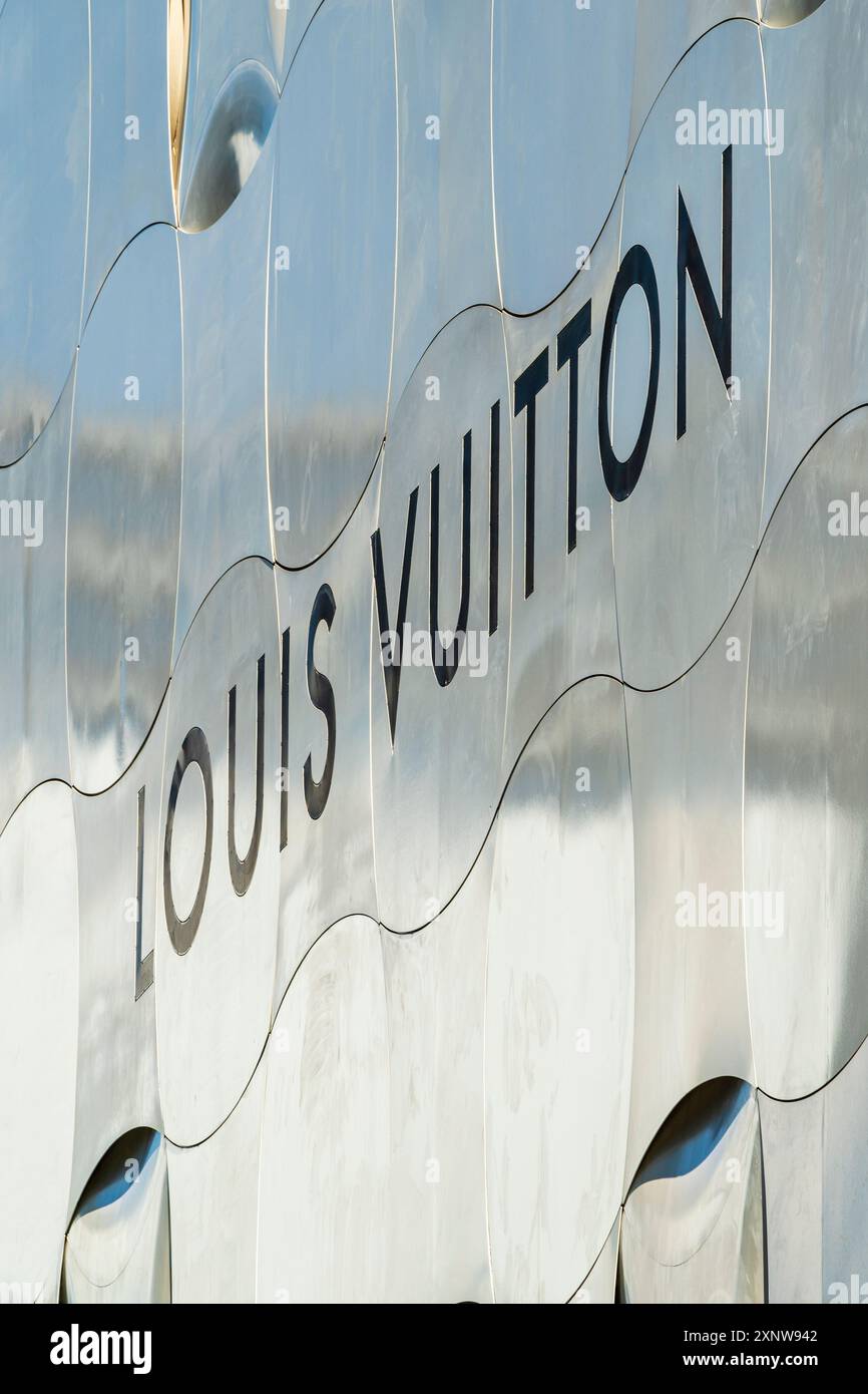 Louis Vuitton fashionable logo brand name in white letters on the front ...