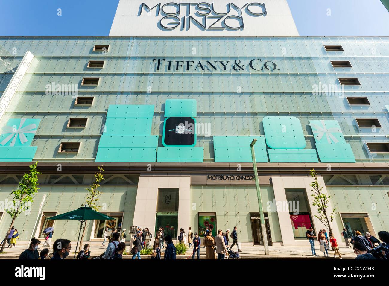 The Matsuya Ginza and combined Tiffany & Co store towering over people ...