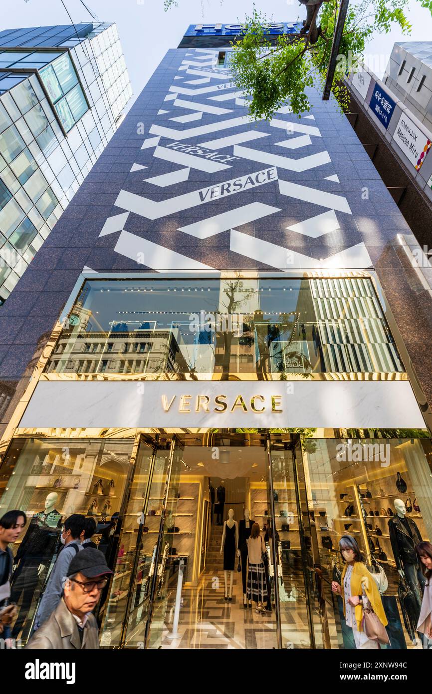 Low angle shot of the entrance to the Versace fashion store on the ...