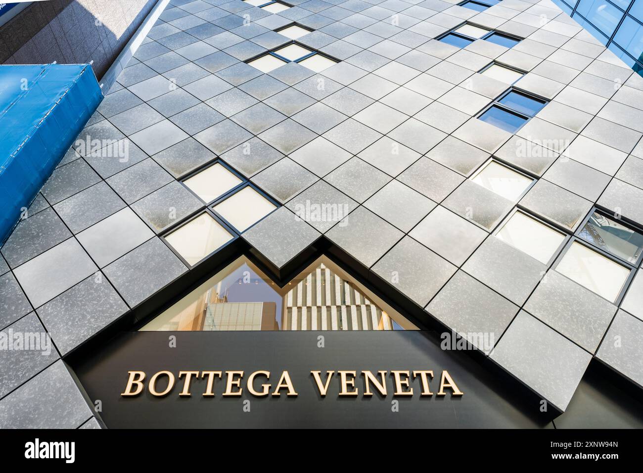 Low angle of the fashionable Ginza Bottega Veneta store with its name ...