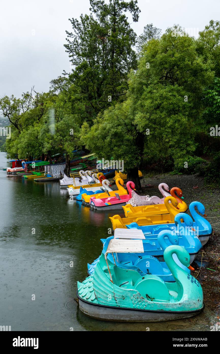 Empty boats lined up on the lakeside at Naukuchiatal Lake during the ...