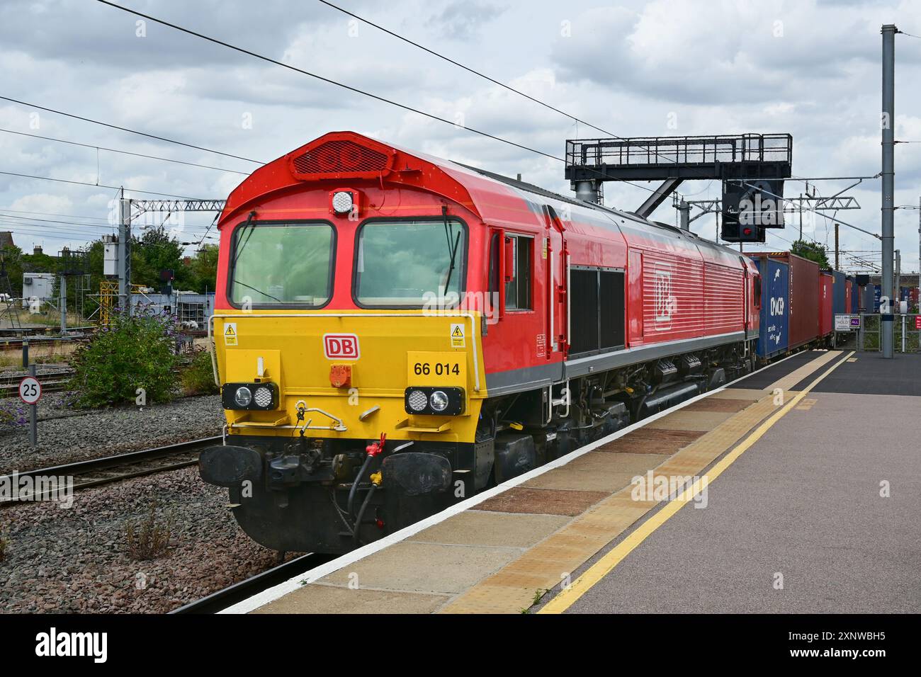DB class 66 diesel leads train of containers south through Peterborough ...