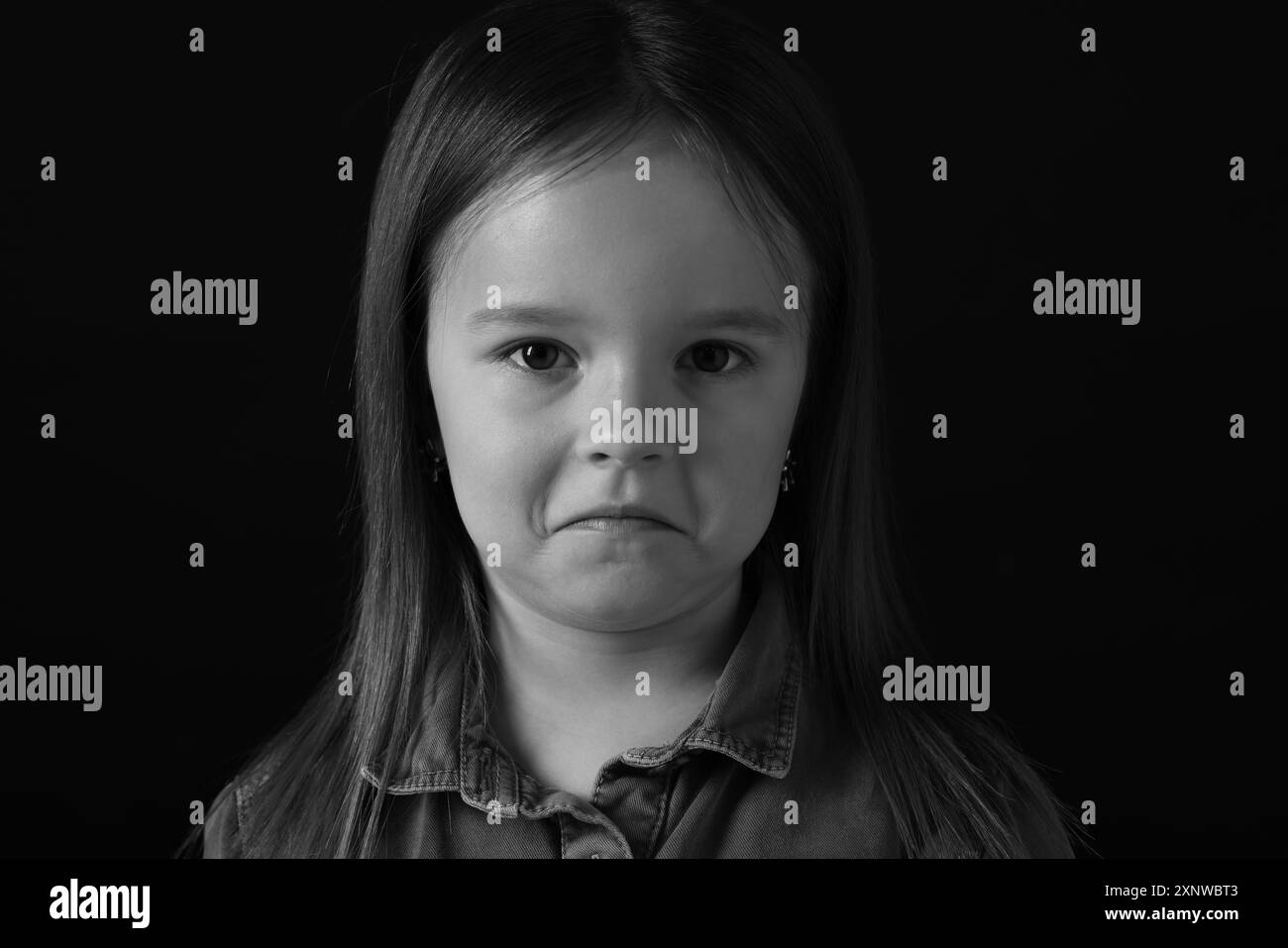 Portrait of sad girl on dark background, closeup. Black and white ...