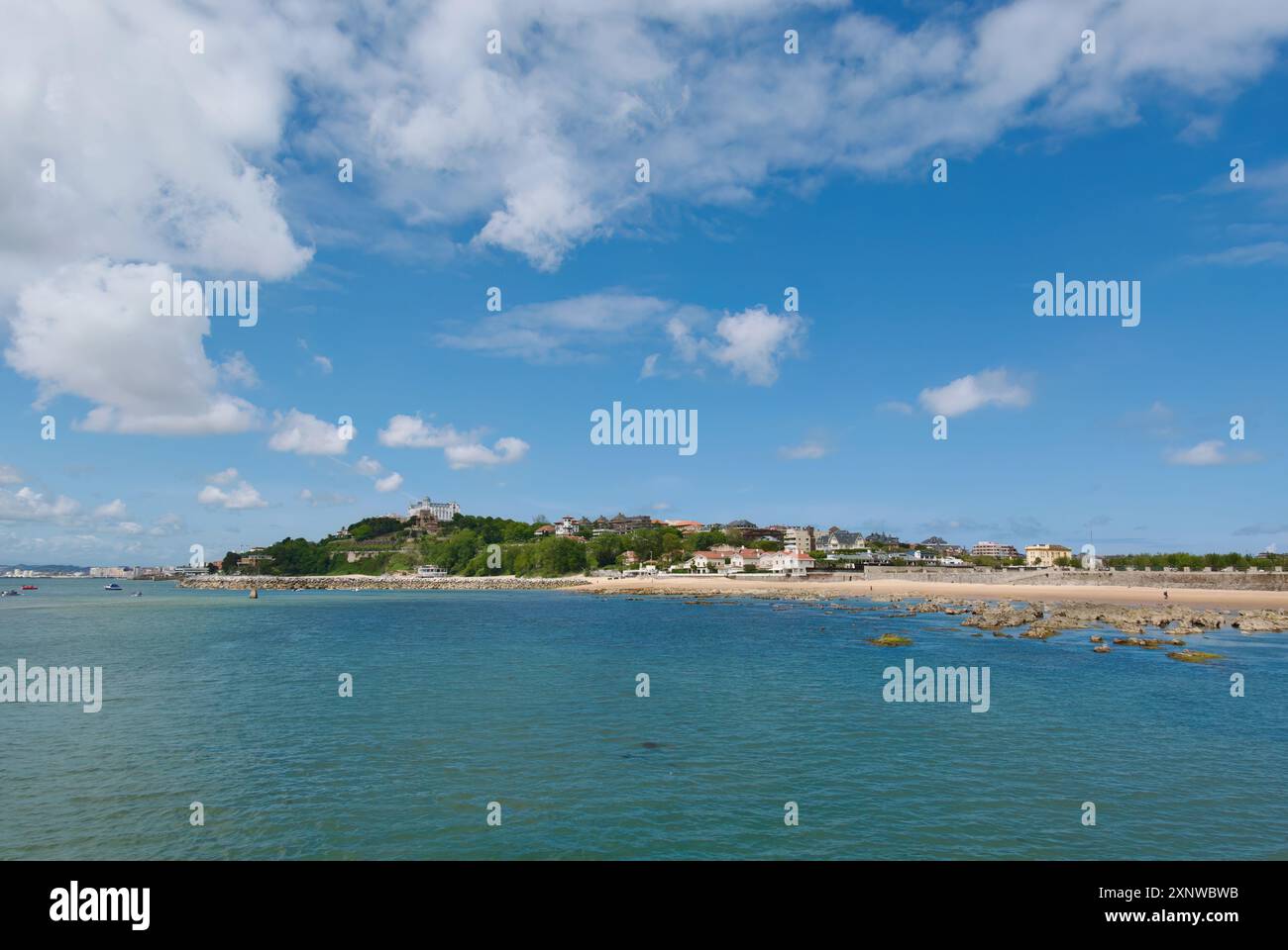 Landscape view of the bikinis beach with the hilltop 5 star Hotel Real ...