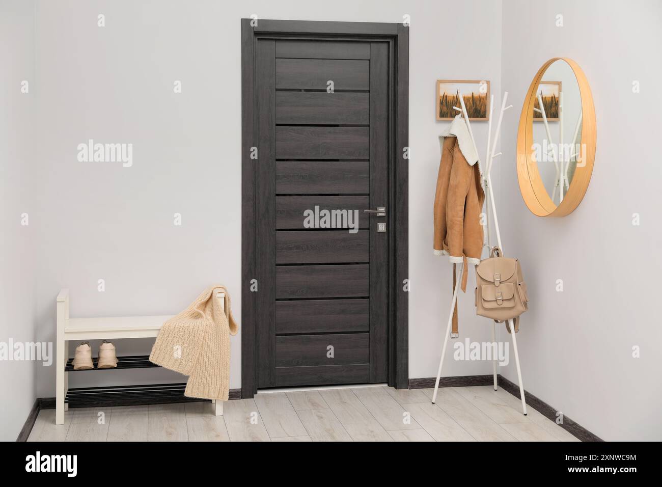 Coat rack, mirror and shoe storage bench in hallway. Interior design ...