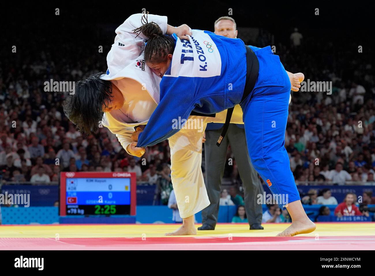 South Korea's Hayun Kim and Turkey's Kayra Ozdemir compete during their ...