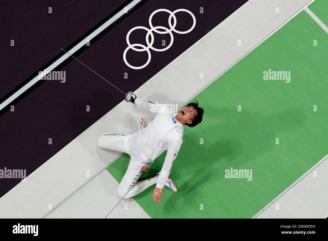 Japan's Masaru Yamada celebrates after winning the men's team epee ...