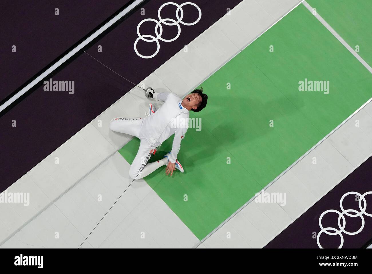 Japan's Masaru Yamada celebrates after winning the men's team epee ...