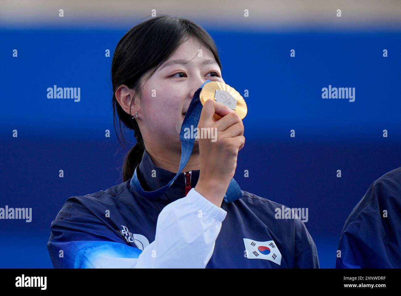 South Korea's Lim Sihyeon holds the gold medal after winning, along ...