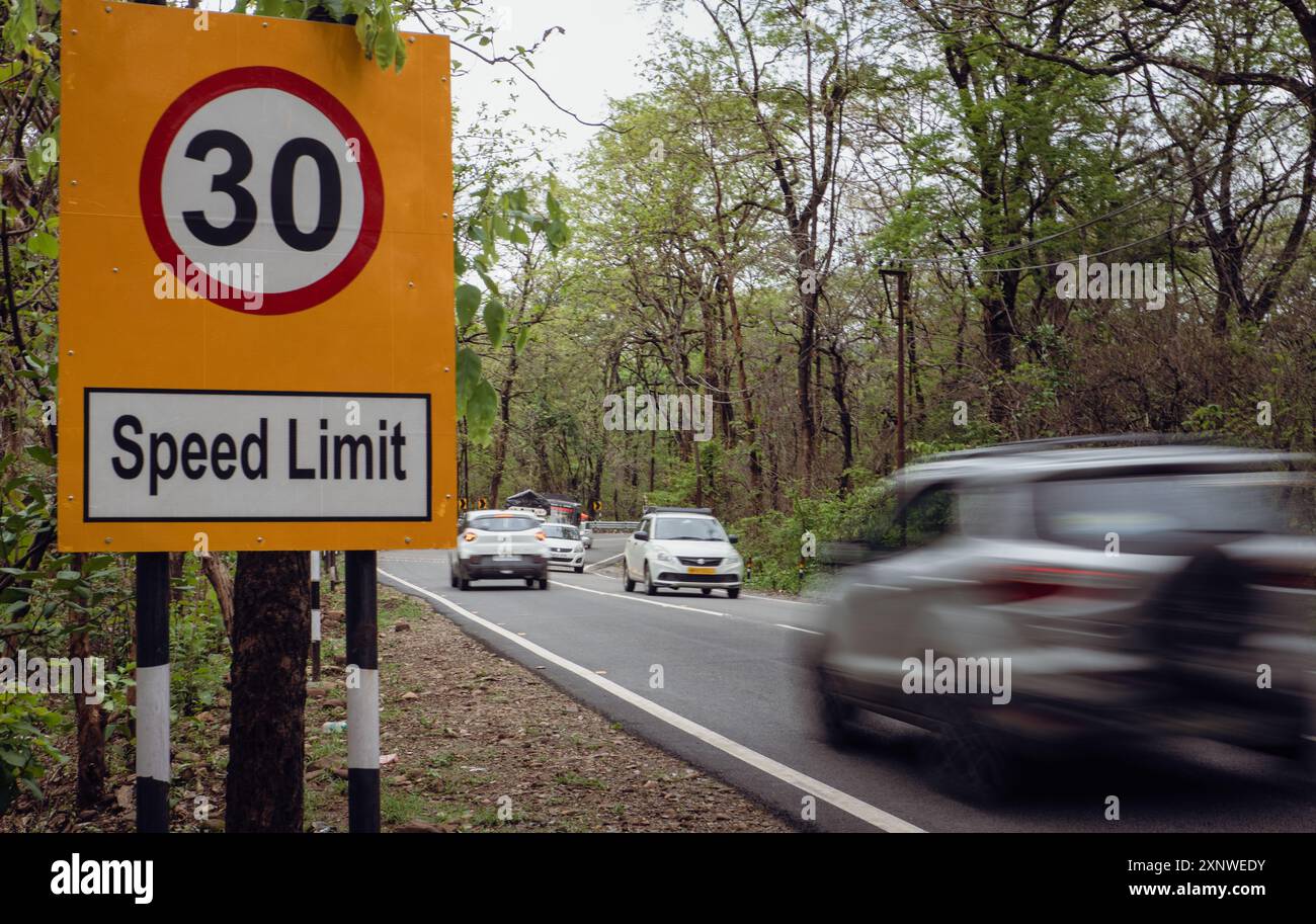 Aug2nd2024, Uttarakhand India. 30 km/h speed limit signboard alongside a road with a speeding ...