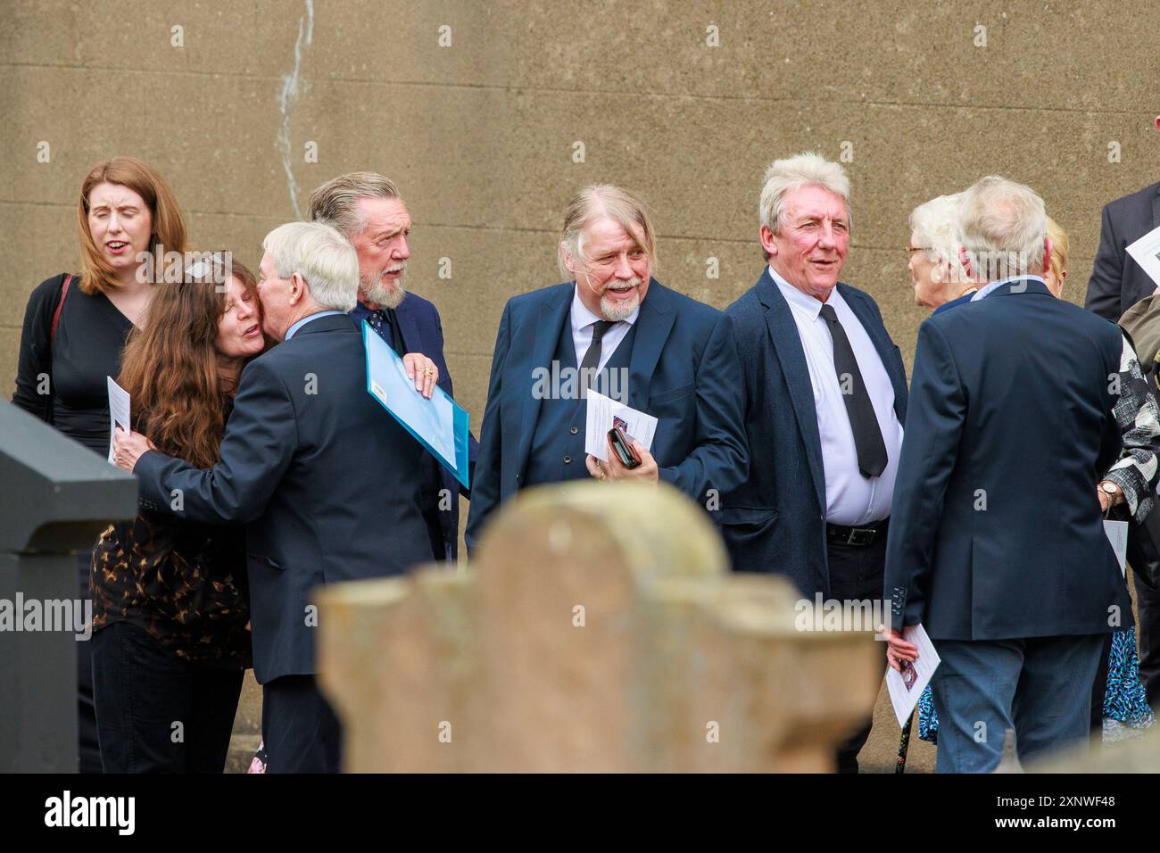 Mike Edgar (centre), who led a tribute at Trinity Presbyterian Church ...