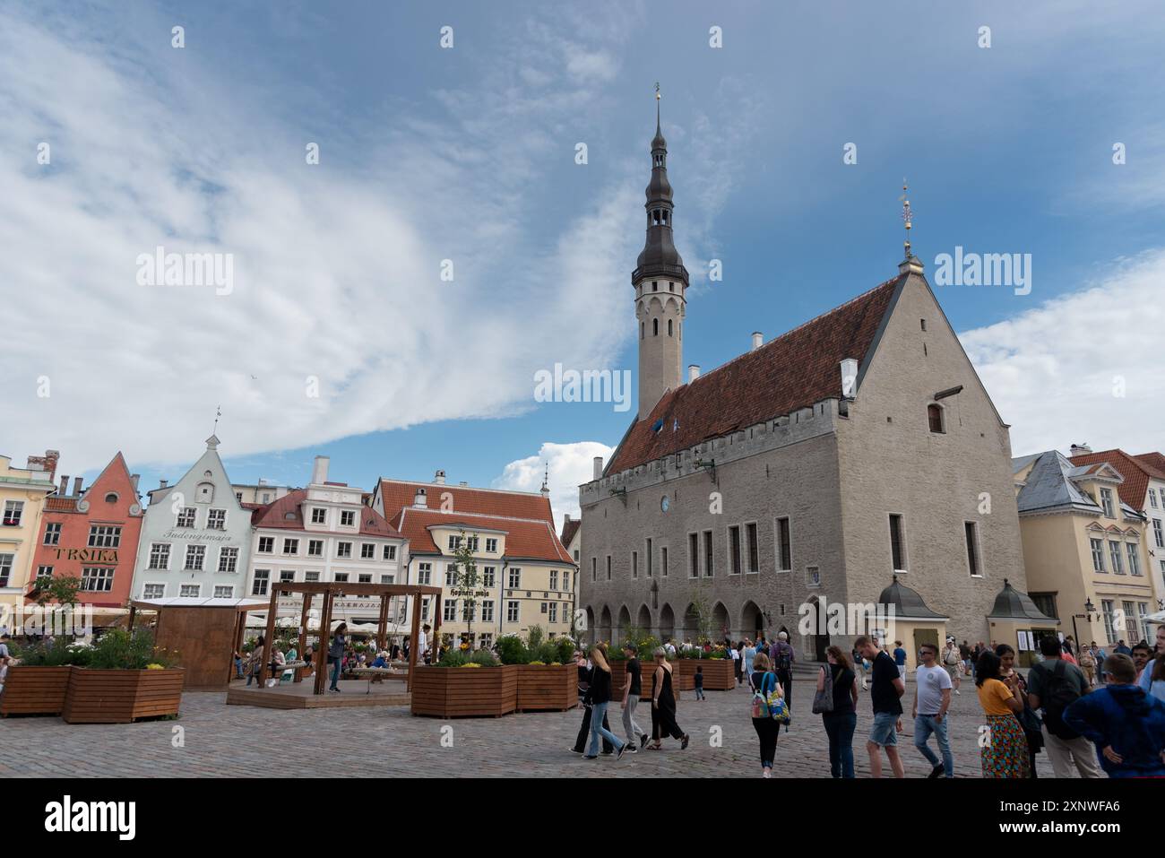 Tallinn old town center and town hall. colorful buildings, coffee shops ...