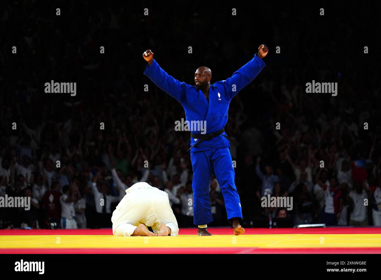 France's Teddy Riner celebrates victory over South Korea's Kim Minjong ...