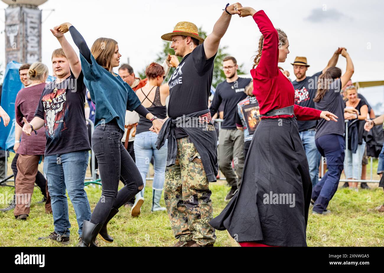 Wacken, Germany. 02nd Aug, 2024. Festival visitors learn medieval ...