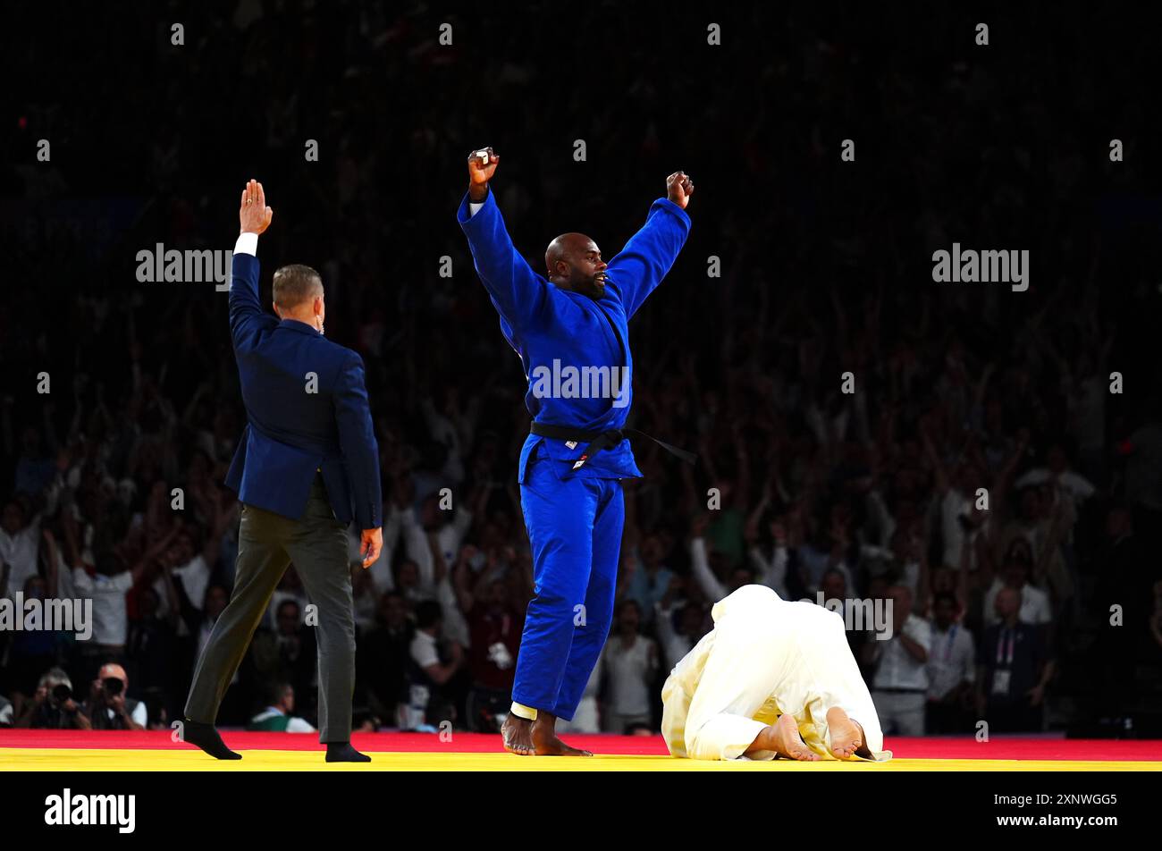France's Teddy Riner celebrates victory over South Korea's Kim Minjong ...