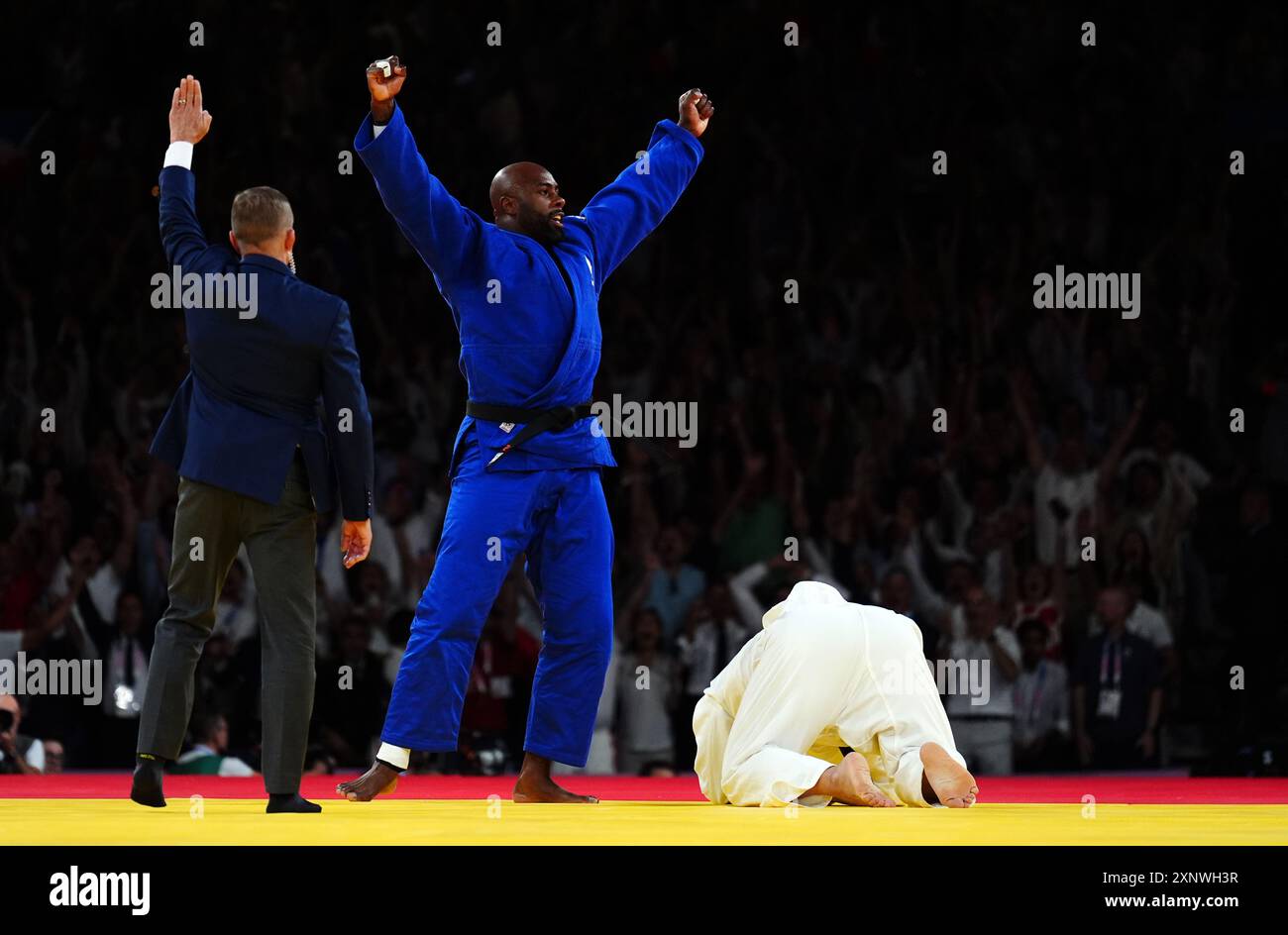 France's Teddy Riner celebrates victory over South Korea's Kim Minjong ...