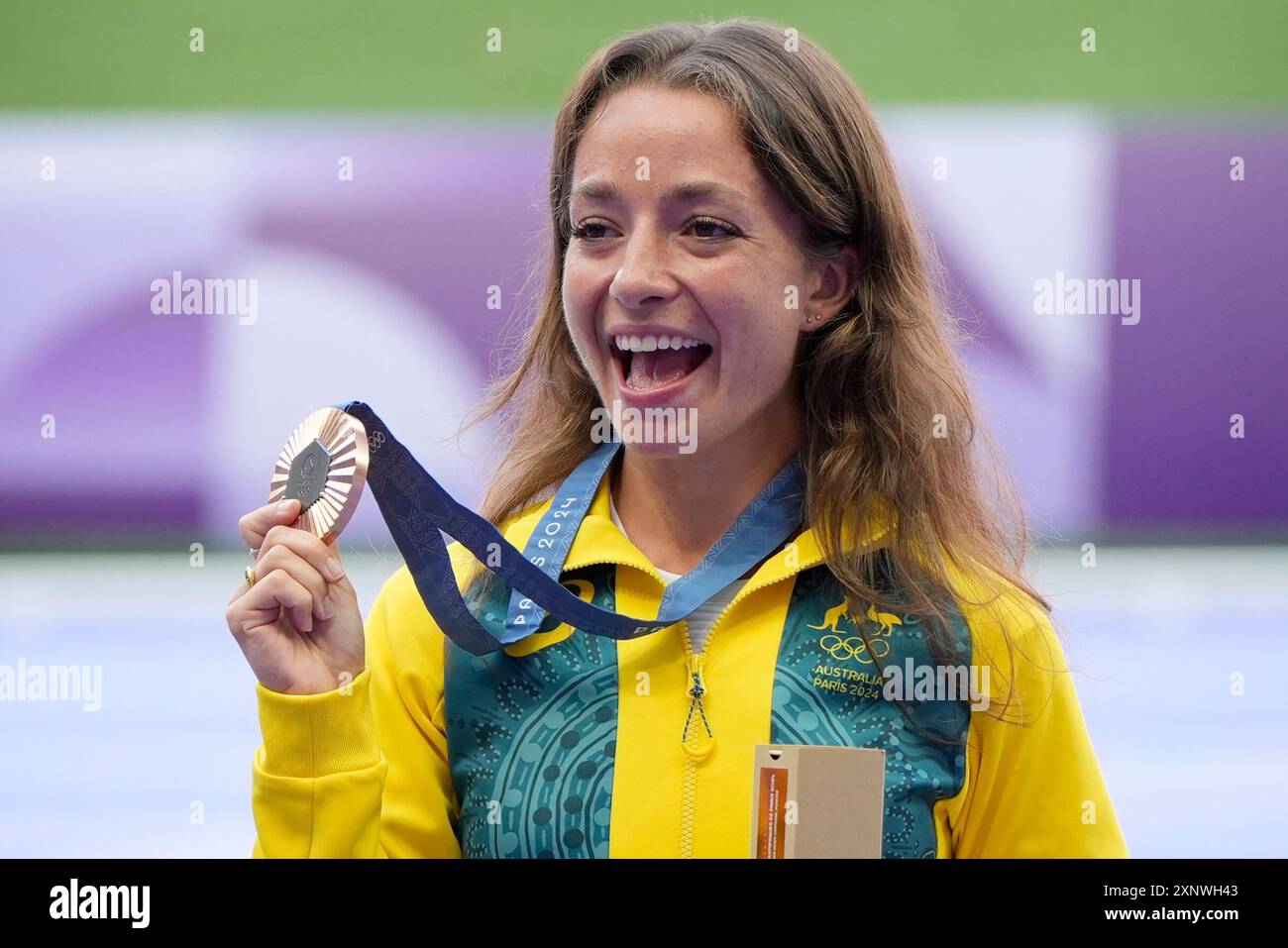 Bronze medalist Jemima Montag, of Australia, stands on the podium after ...