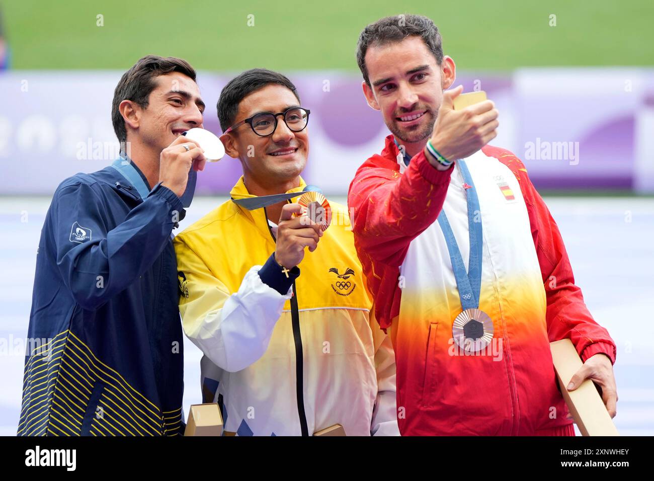 Gold medalist Brian Daniel Pintado, of Ecuador, poses with silver ...