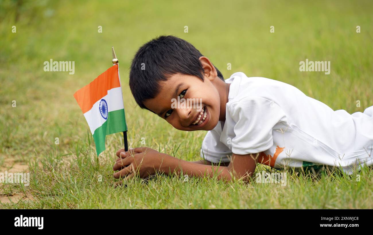 Handsome cute little Indian boy or kid in white ethnic wear standing ...