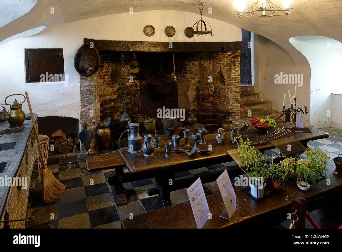 Kasteel van Laarne, interior showing kitchen and open fireplace inside ...