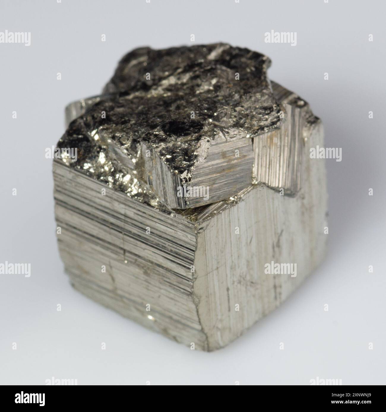 natural silver pyrite gem on white background Stock Photo - Alamy