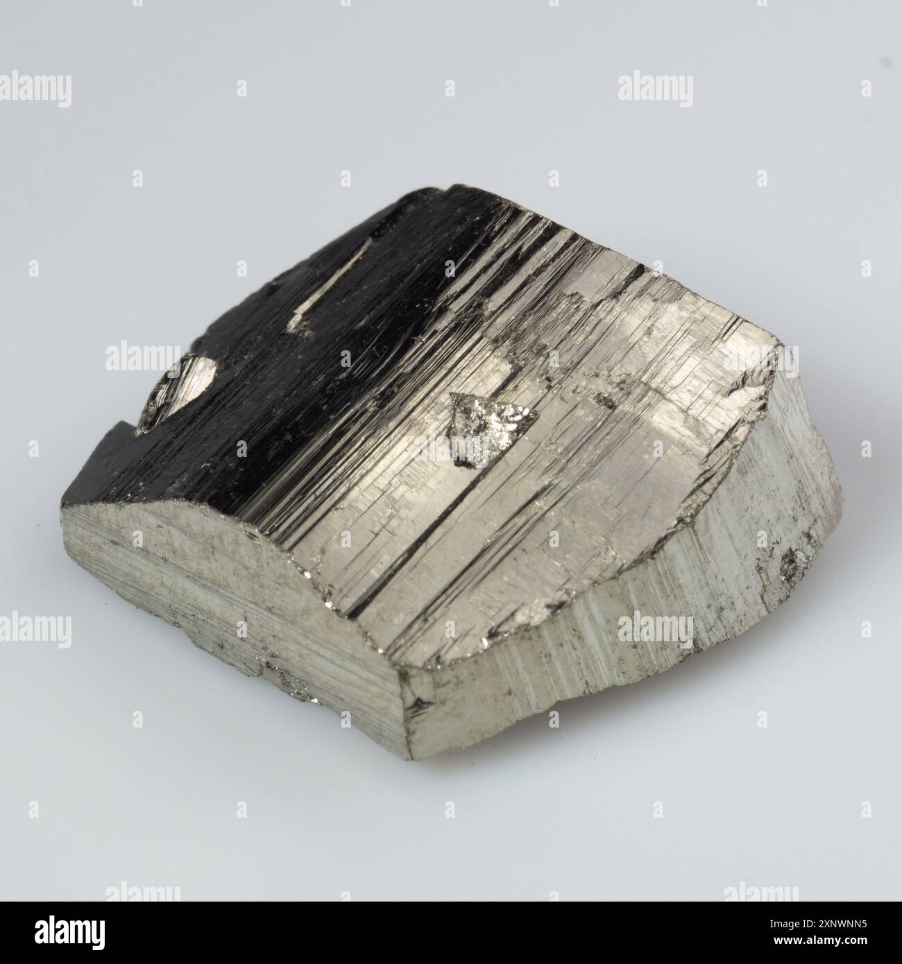 natural silver pyrite gem on white background Stock Photo - Alamy