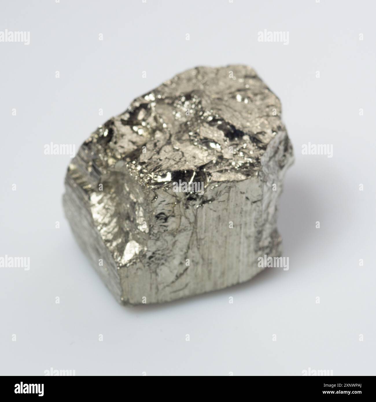 natural silver pyrite gem on white background Stock Photo - Alamy