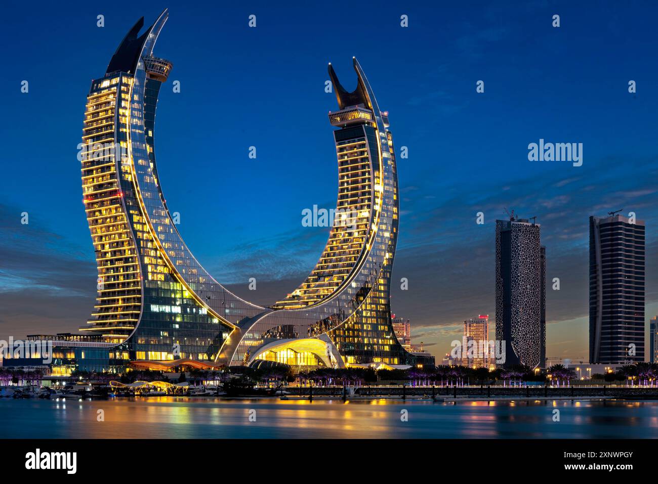 Katara buildings view from Lusail Marina Park. Crescent Tower Stock ...