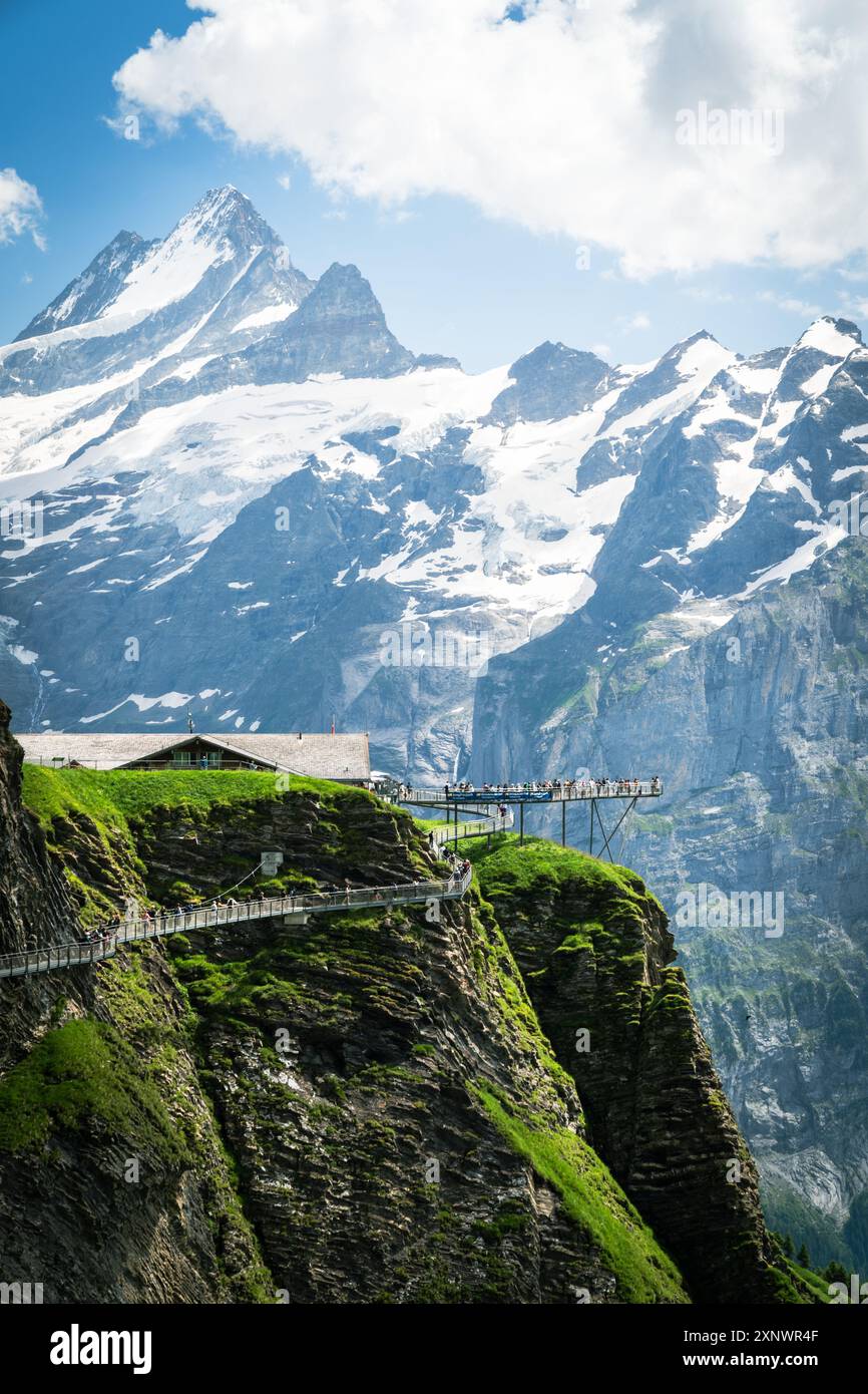 View of Grindelwald First Cliff Walk, with many tourists walking the ...