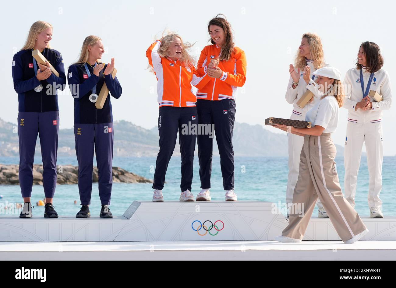 Netherlands' Odile van Aanholt, center left and Annette Duetz, react as ...