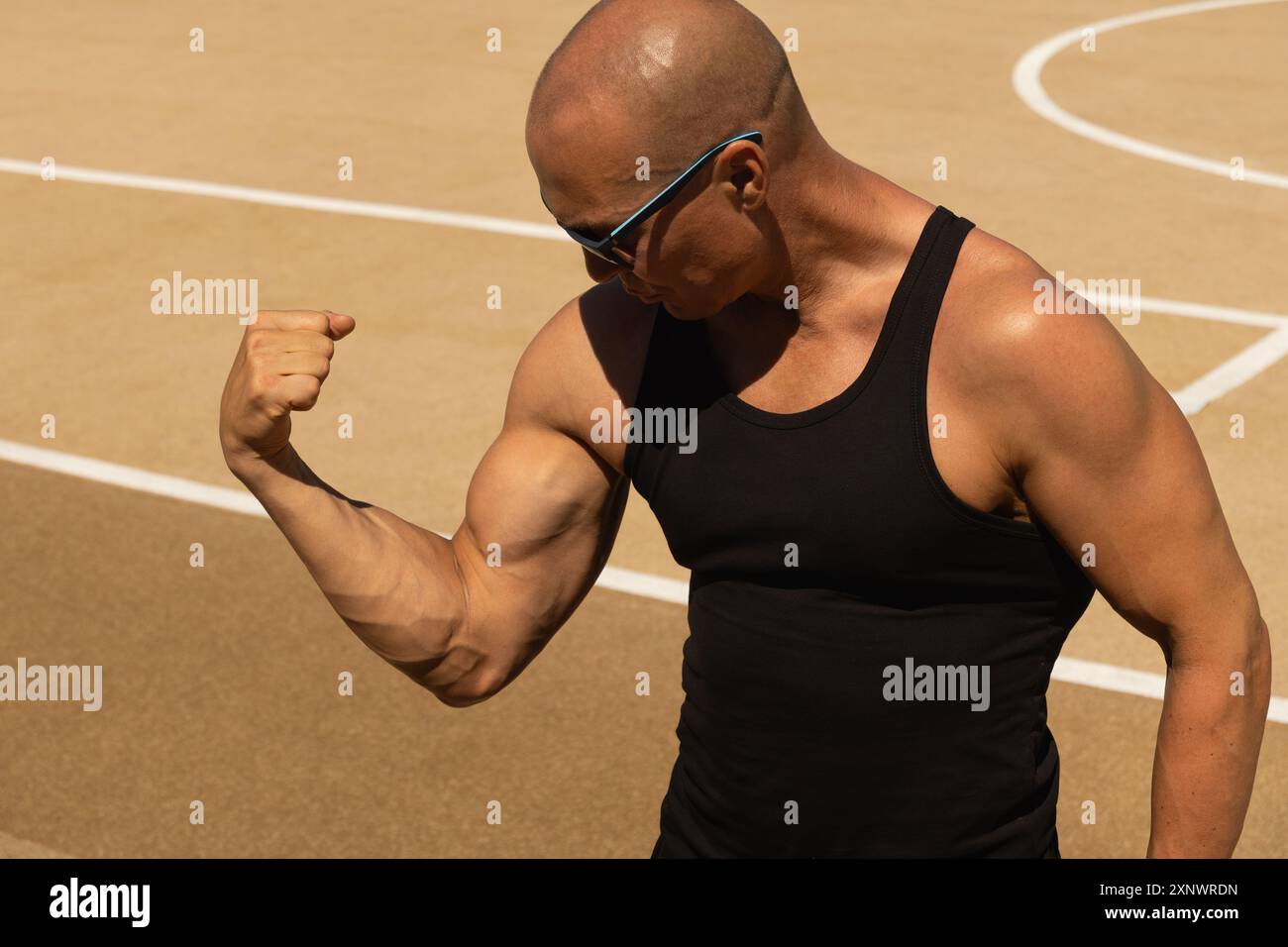 Strong bald bodybuilder man with perfect abs, shoulders, biceps ...