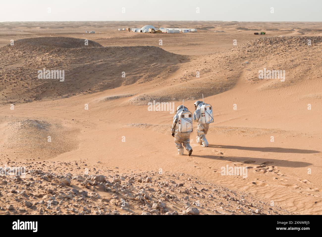 Two analog astronauts walking in the Dhofar Region, Oman as part of a ...