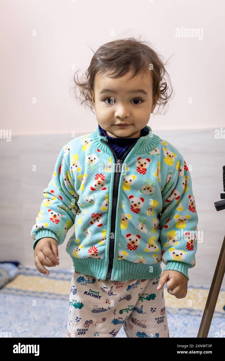 smiling kid innocent facial expression at indoor at night Stock Photo ...