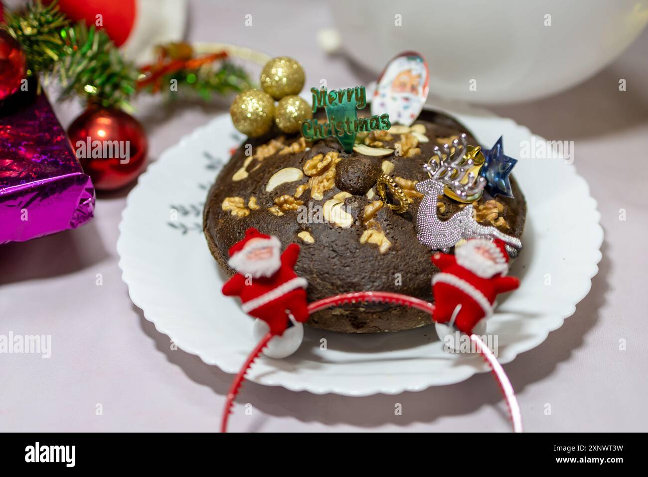 Christmas eve celebration with cake and decorative items at home at ...
