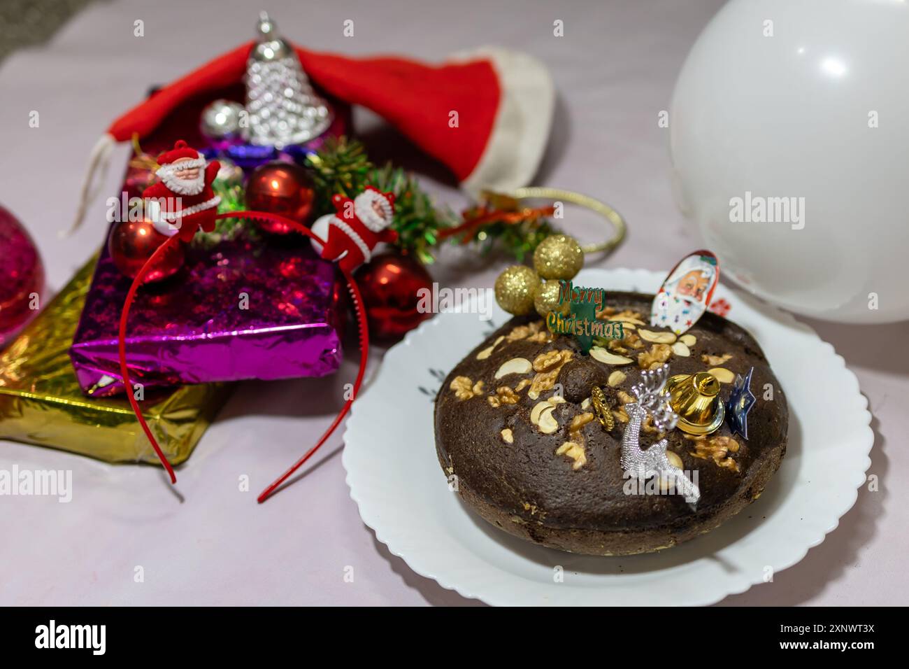 Christmas eve celebration with cake and decorative items at home at ...