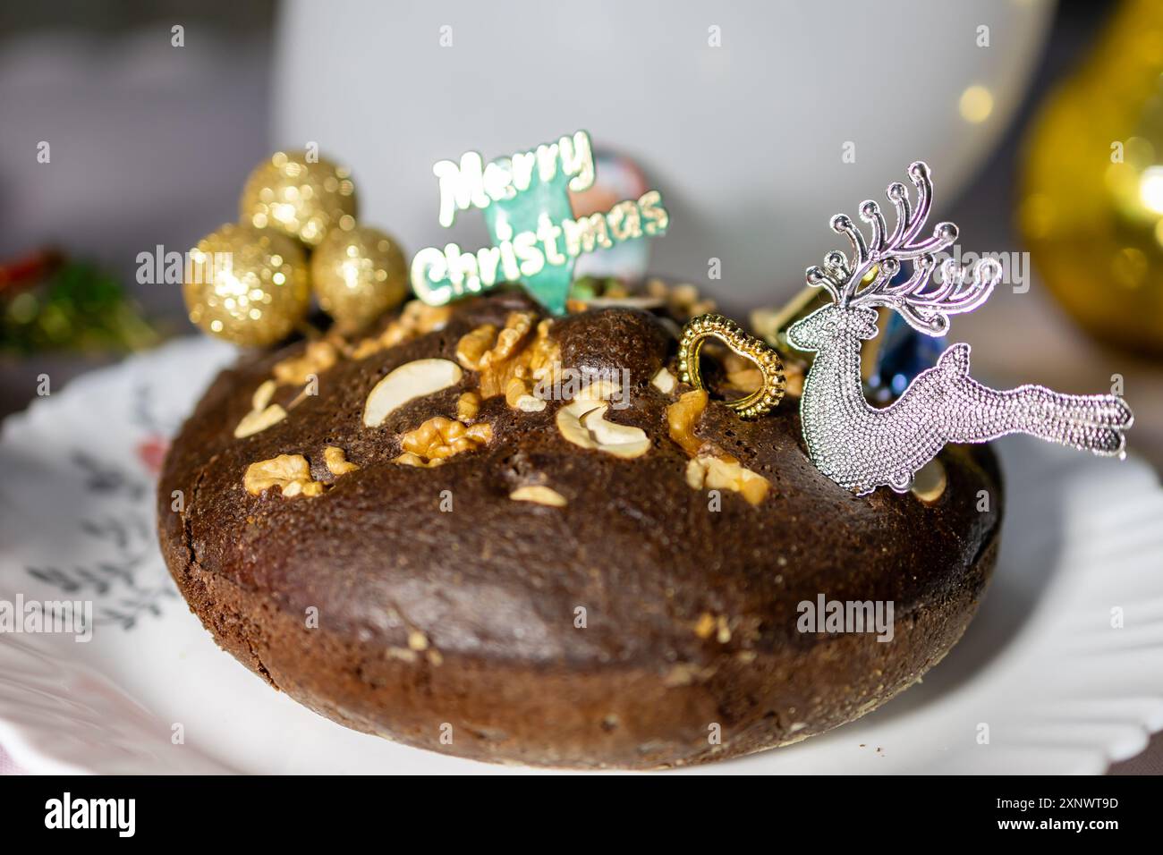 Christmas eve celebration with cake and decorative items at home at ...