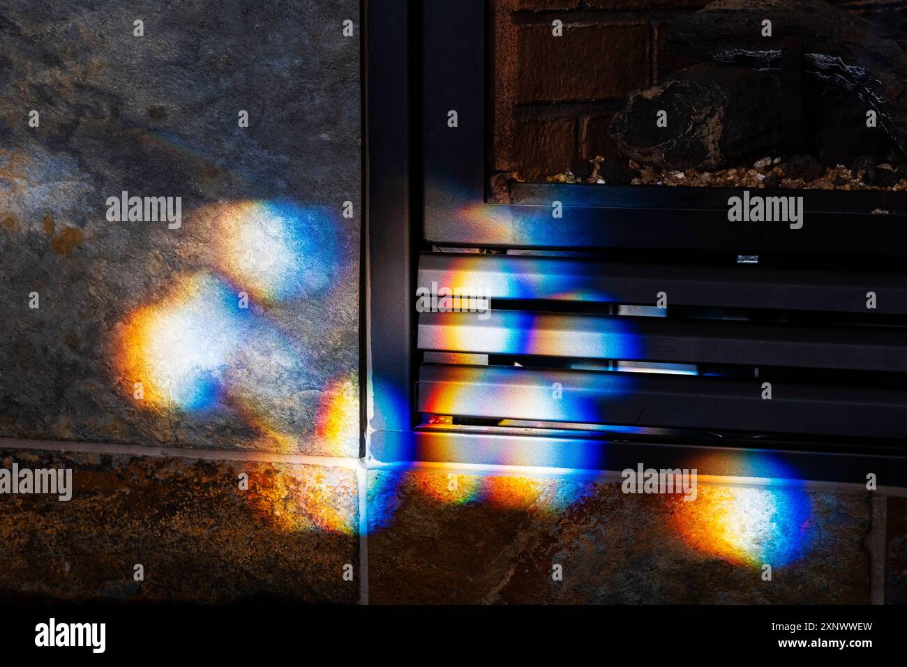 Colorful refracted sunlight through stained glass window illuminates ...