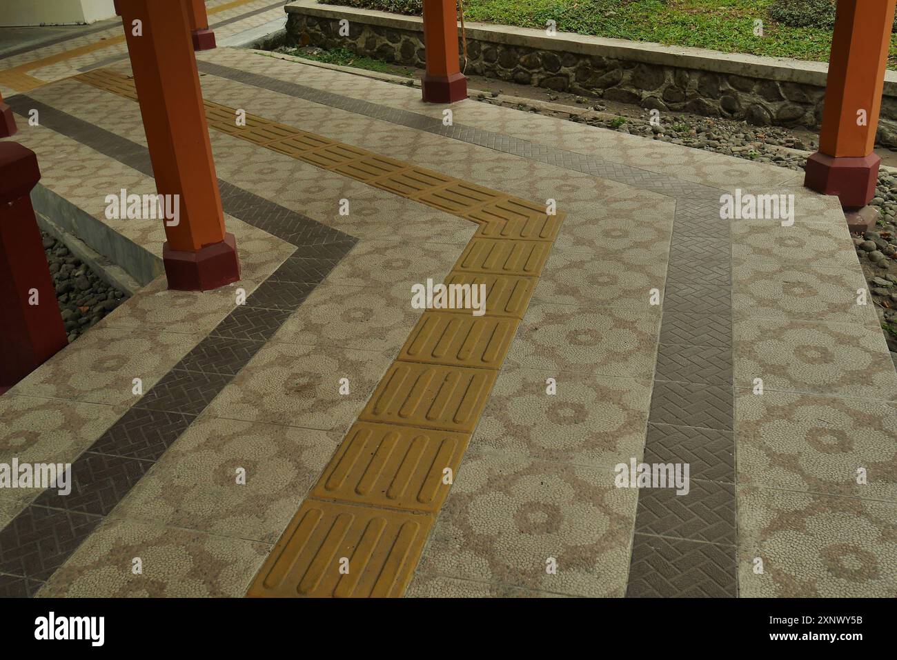 Pedestrian areas equipped with raised tiles for guidance for the blind ...