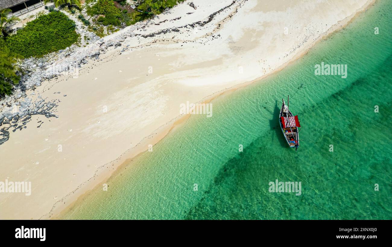 Aerial of a traditional Dhow on a white sand beach, Goa island near the ...