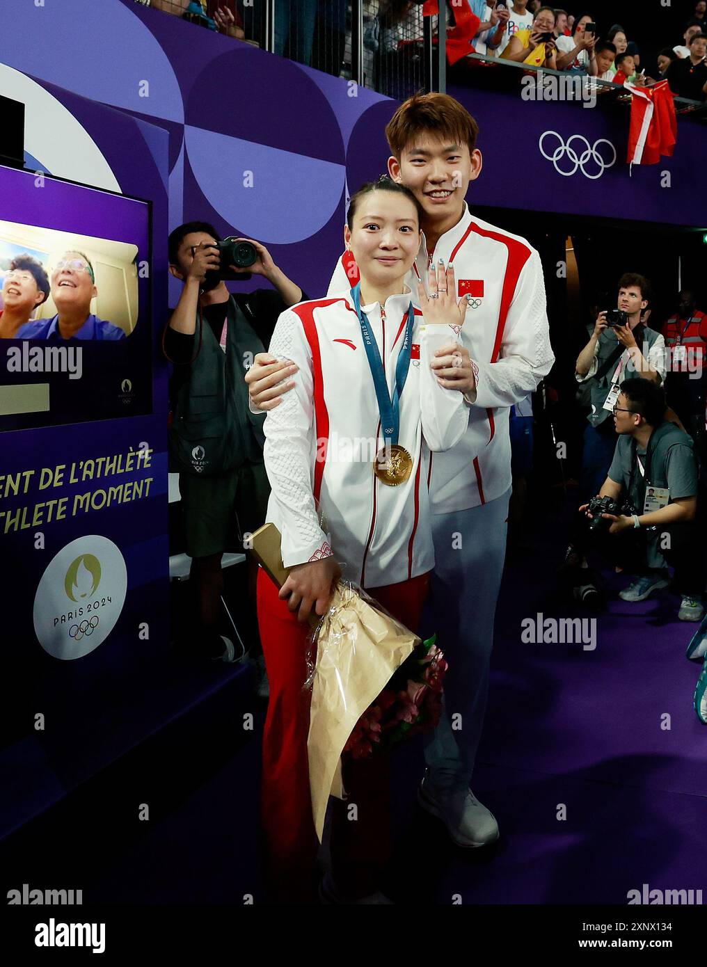 Paris, France. 2nd Aug, 2024. Chinese badminton player Liu Yuchen (R) and his fiancee, gold ...